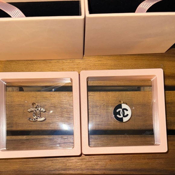 CHANEL | Accessories | Chanel Black And Gold Logo Pendants | Poshmark